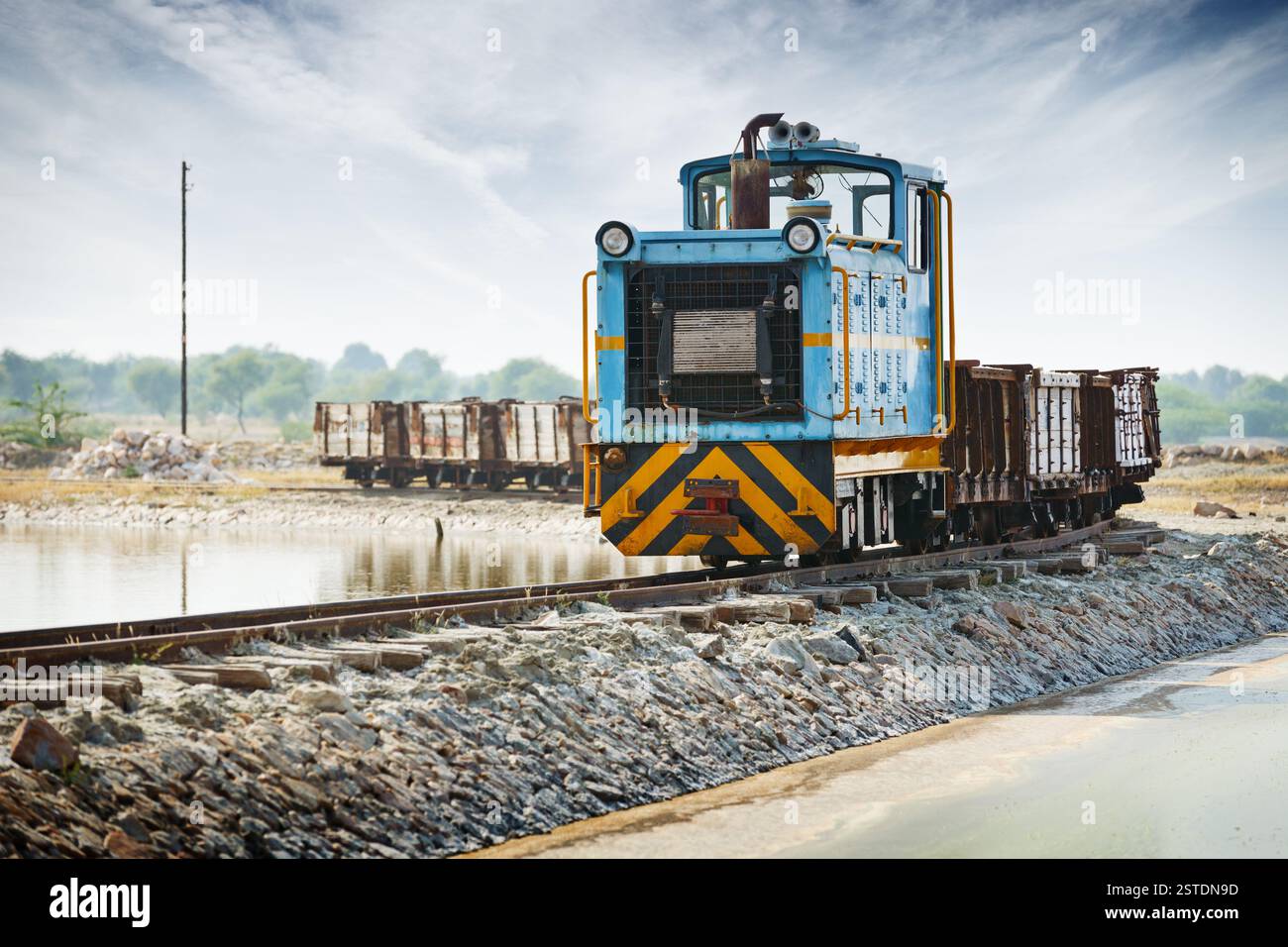 Old small blue locomotive and freight train Stock Photo - Alamy