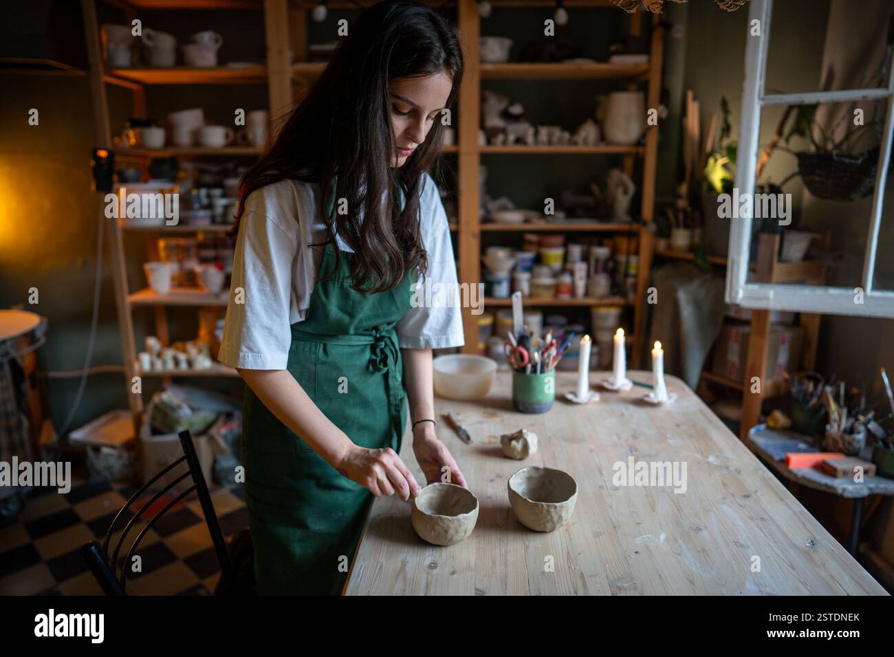Creating handicraft pottery. Working table in ceramics studio with ...