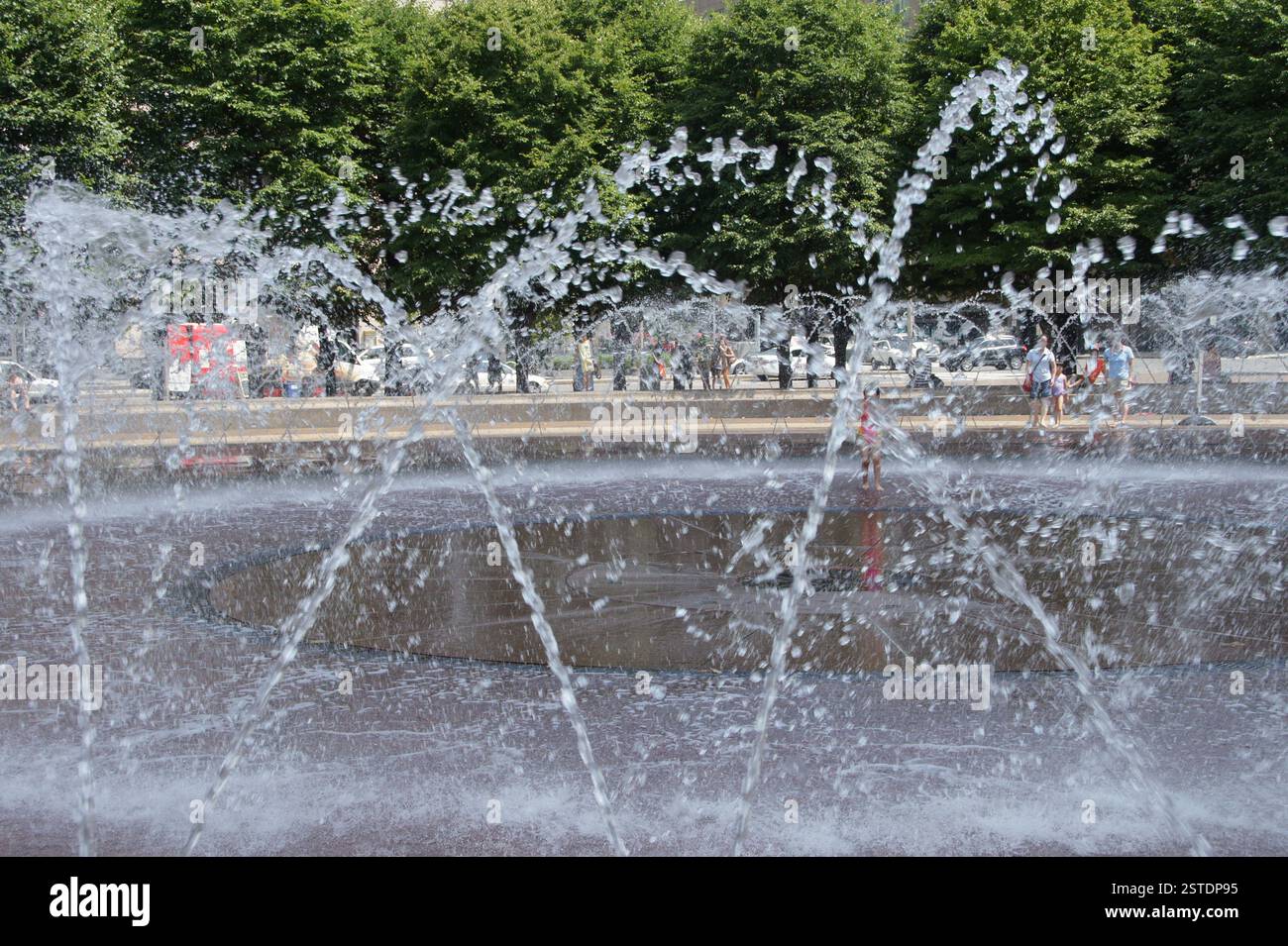 Fountain in Boston. Water sprays high into the air, creating a misty ...