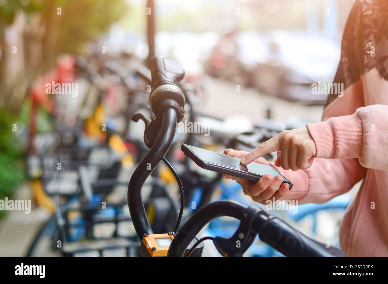 People use smart phone to scan the QR code on a shared bike to unlock ...