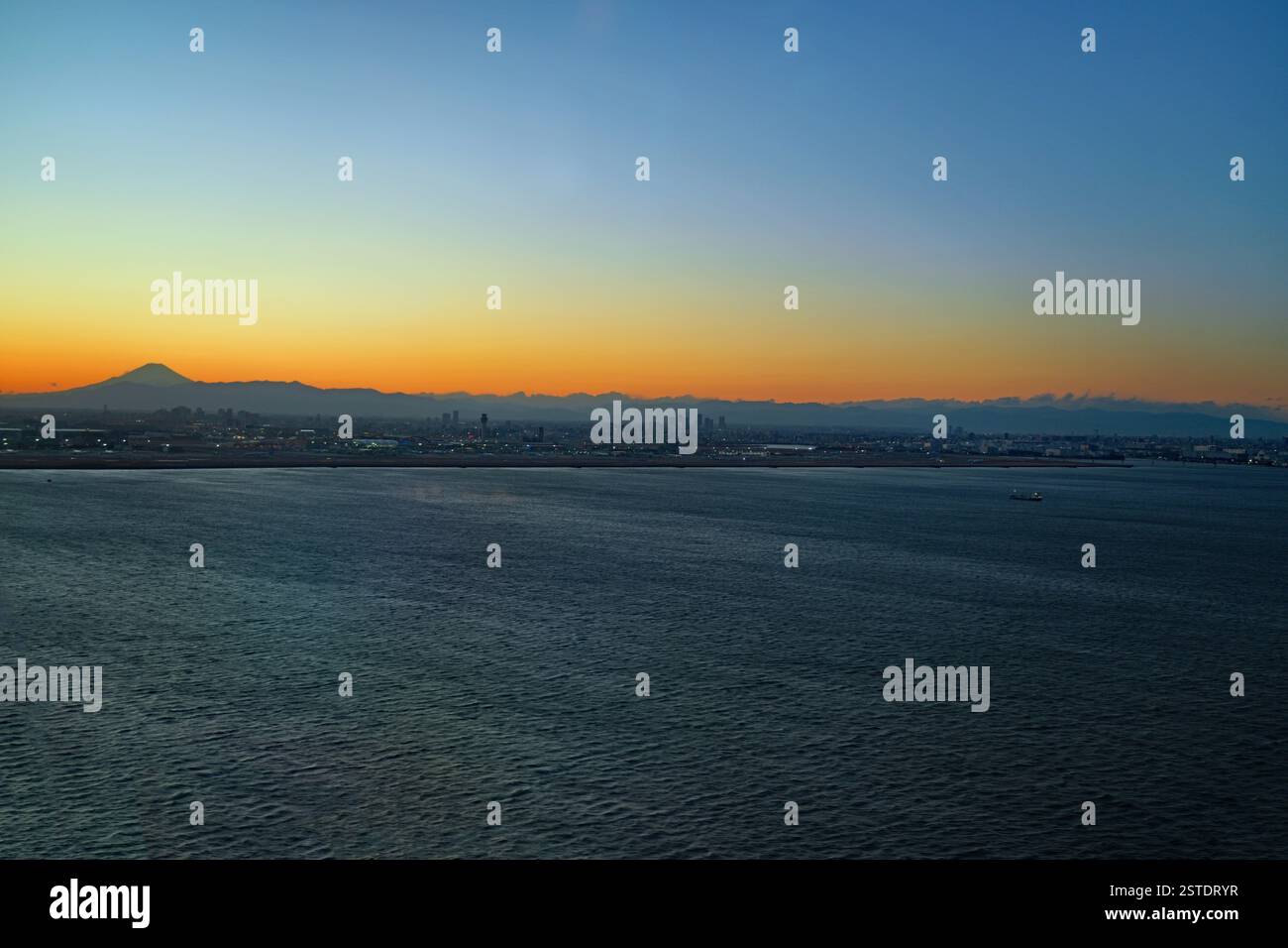 Aerial view of the Tokyo Bay, Japan, at nightfall in approach at Haneda ...