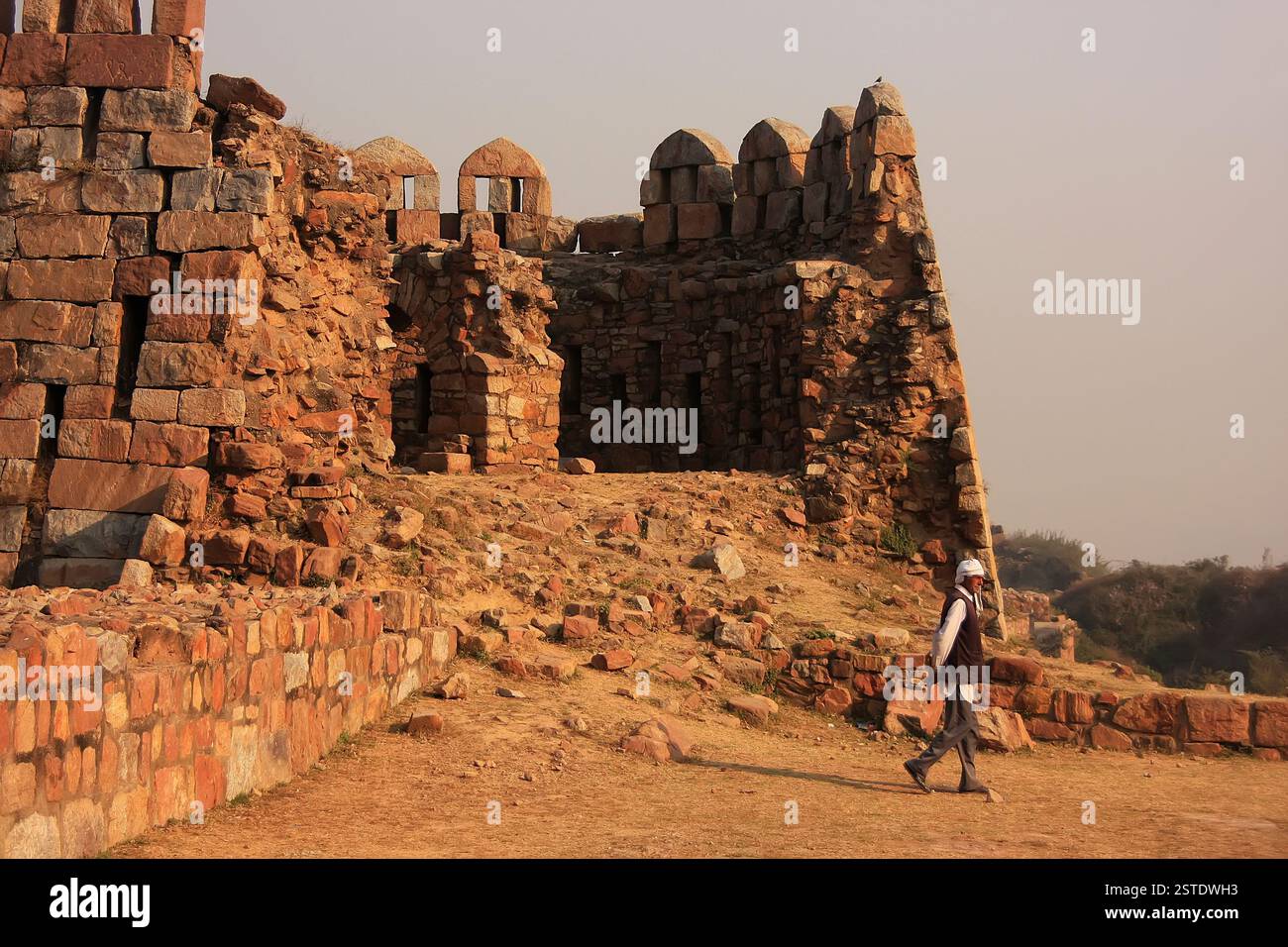 Local guard walking around Tughlaqabad Fort, New D Stock Photo - Alamy