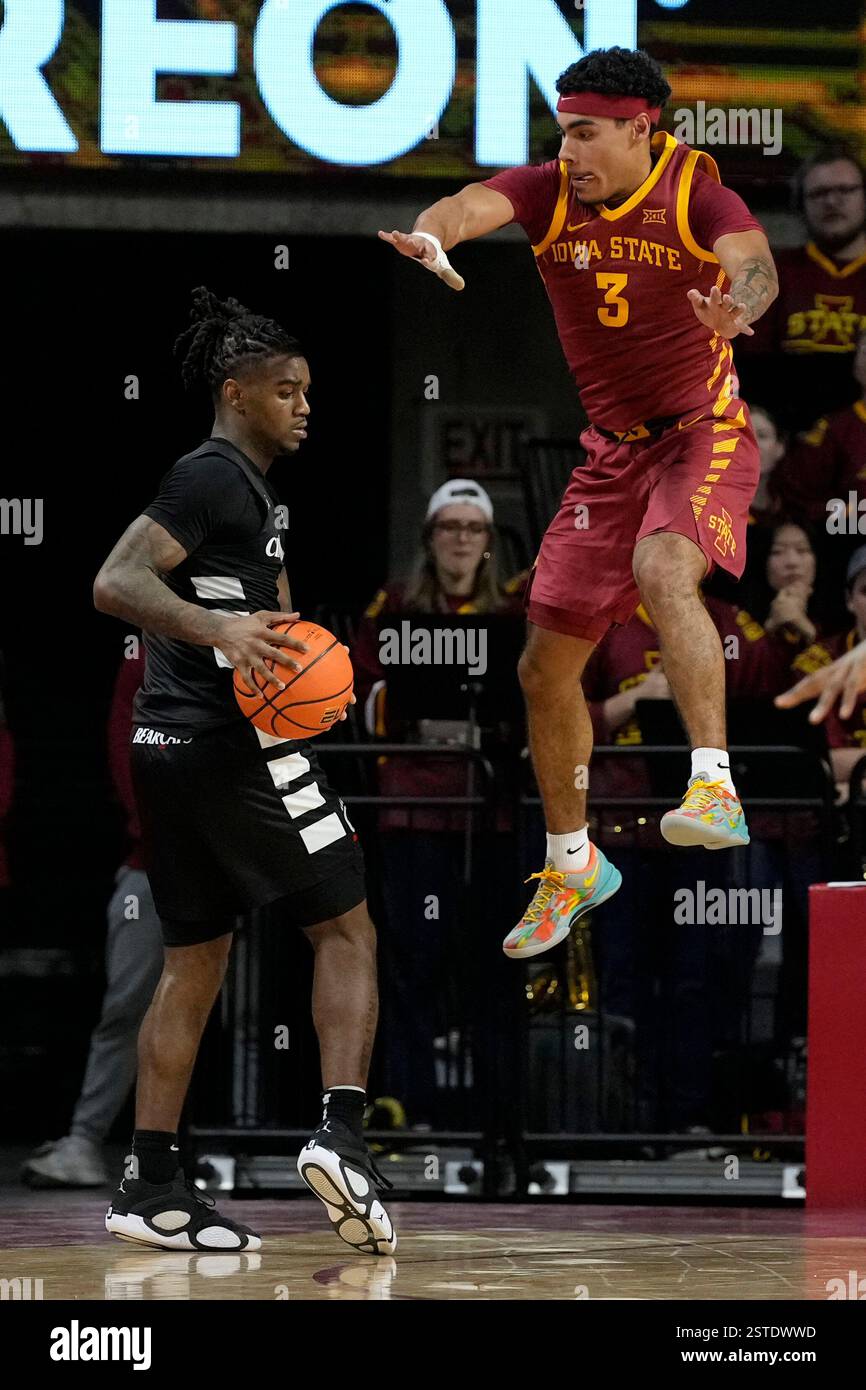 Cincinnati guard Jizzle James, left, drives past Iowa State guard Tamin ...