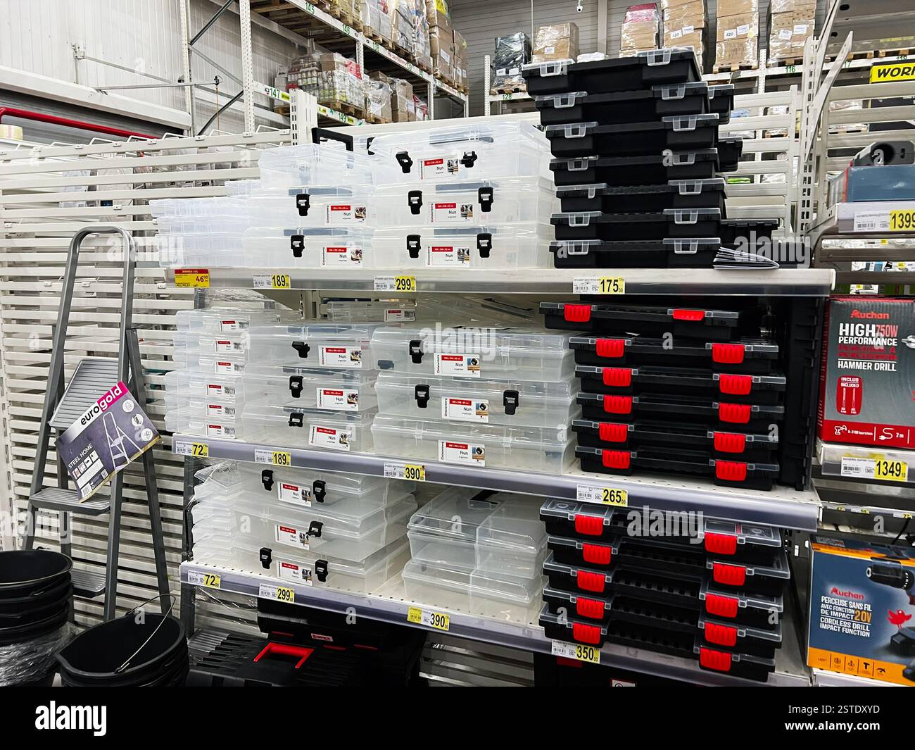 Lviv, Ukraine - February 16, 2025: Rows of assorted plastic storage containers and toolboxes in ...