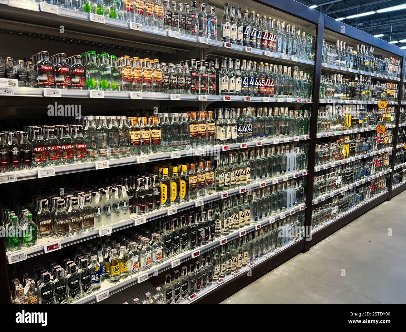 Lviv, Ukraine - February 16, 2025: Variety of liquor bottles organized ...