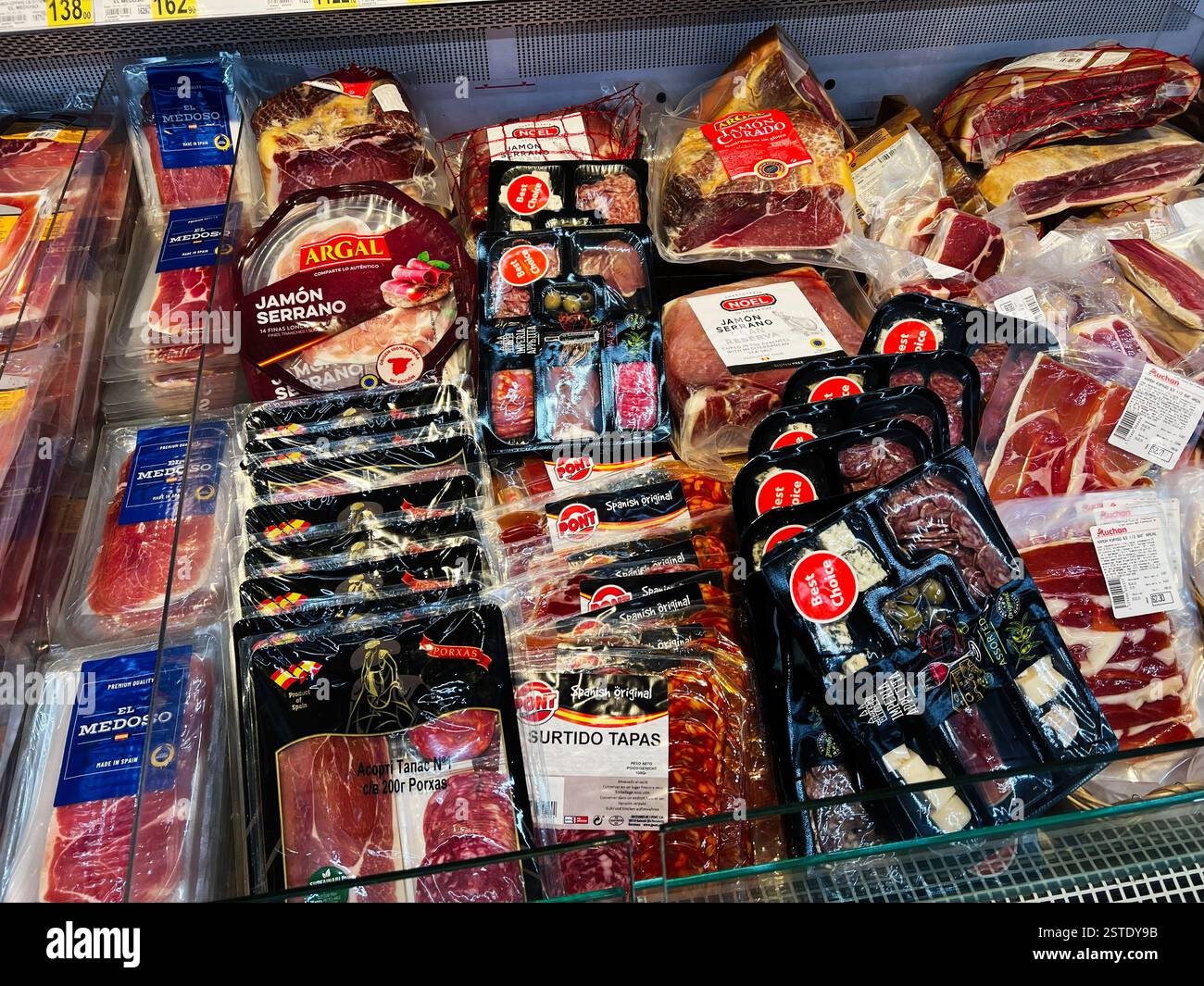 Lviv, Ukraine - February 16, 2025: Assorted packs of cured meat and ham ...