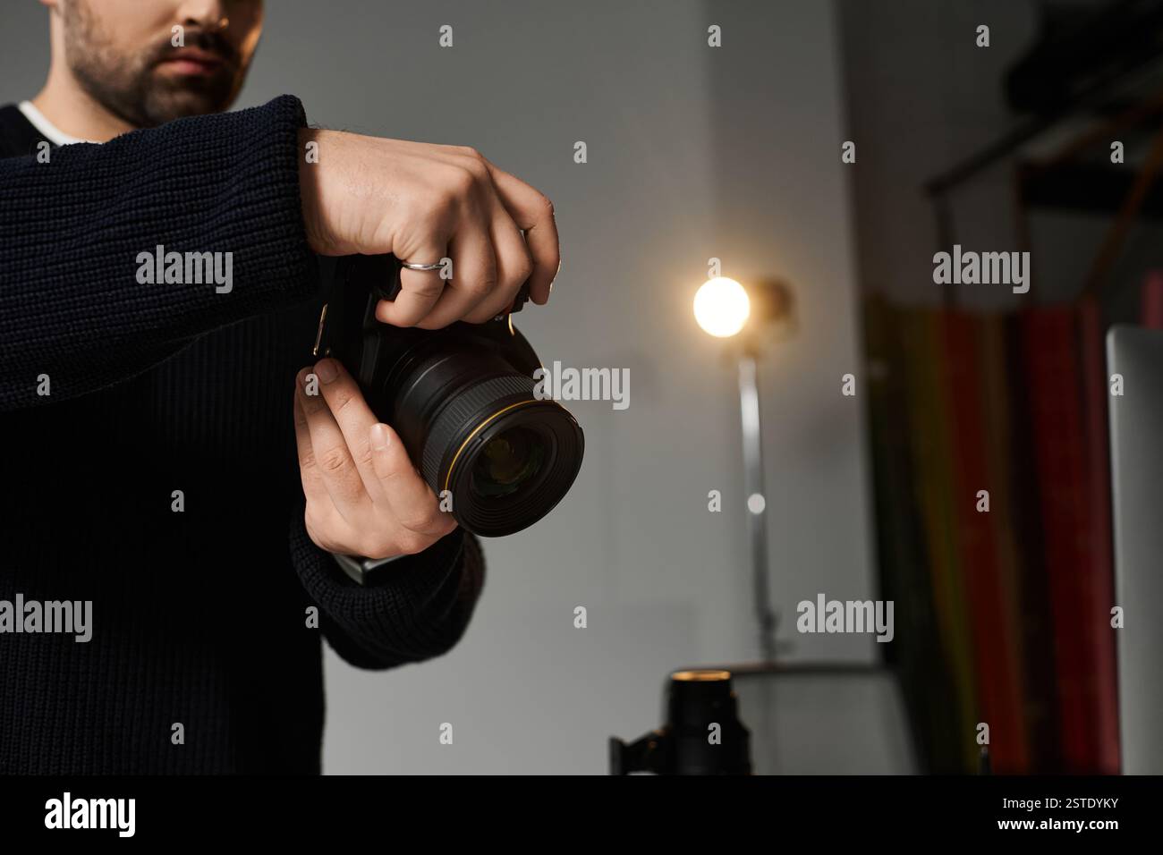 A dedicated individual prepares his camera for an artistic photography ...