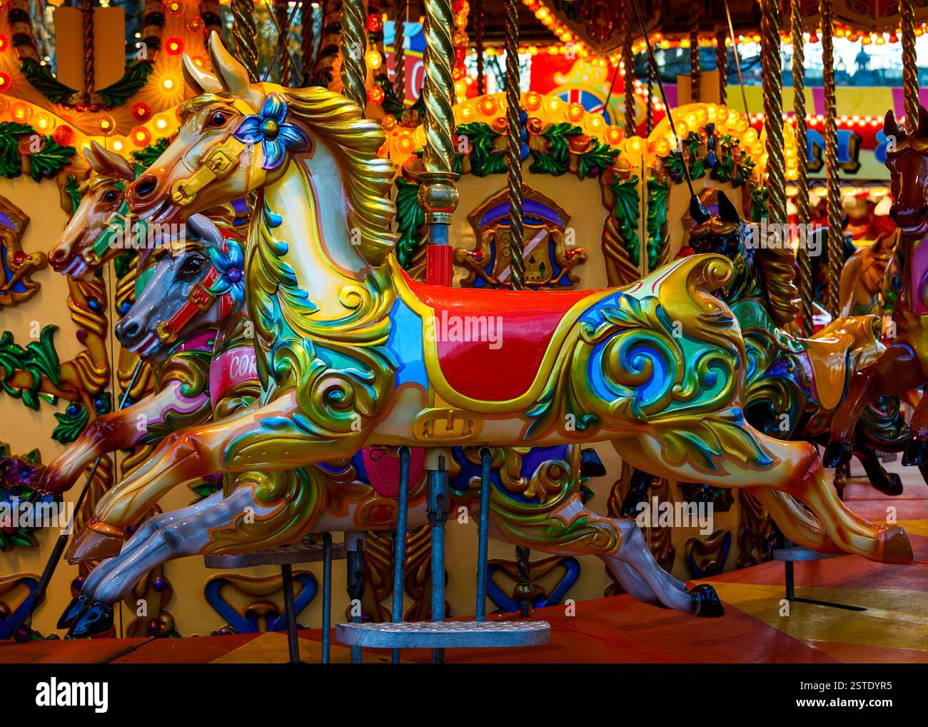 Vintage merry-go-round horses at a funfair Stock Photo - Alamy