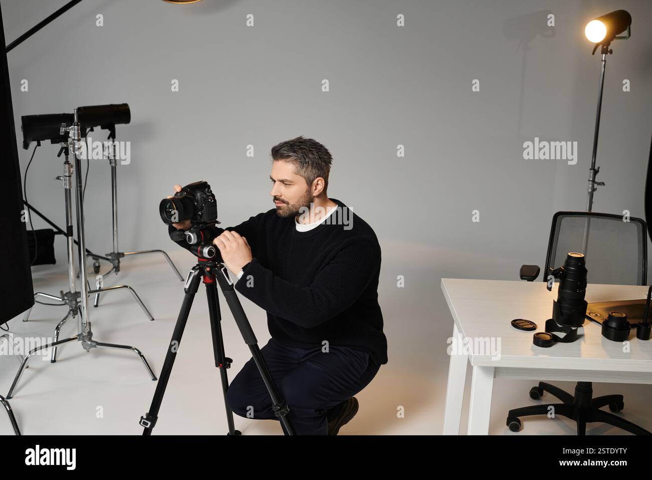 A pro is setting up his camera gear for an exciting studio shoot Stock ...