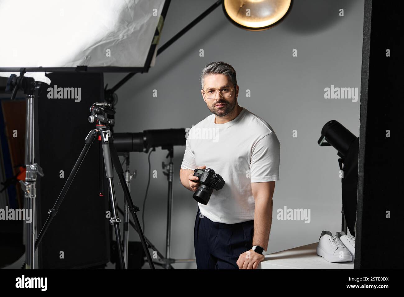 A man stands confidently in a studio, ready to capture stunning visuals ...