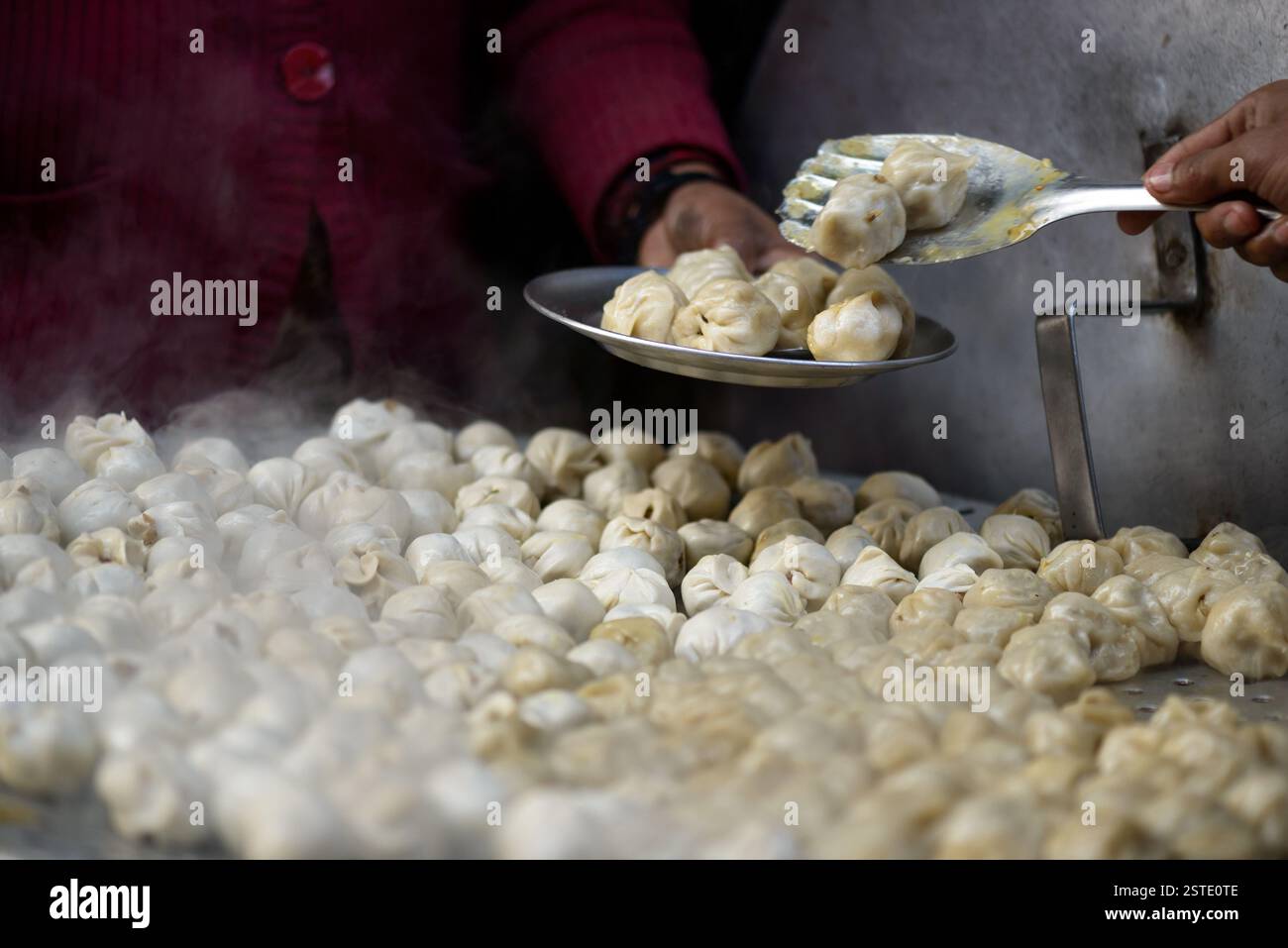 Momo serving hi-res stock photography and images - Alamy