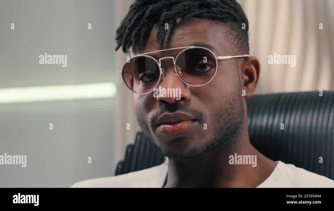 Portrait serious stylish fashionable African American cyber man in ...