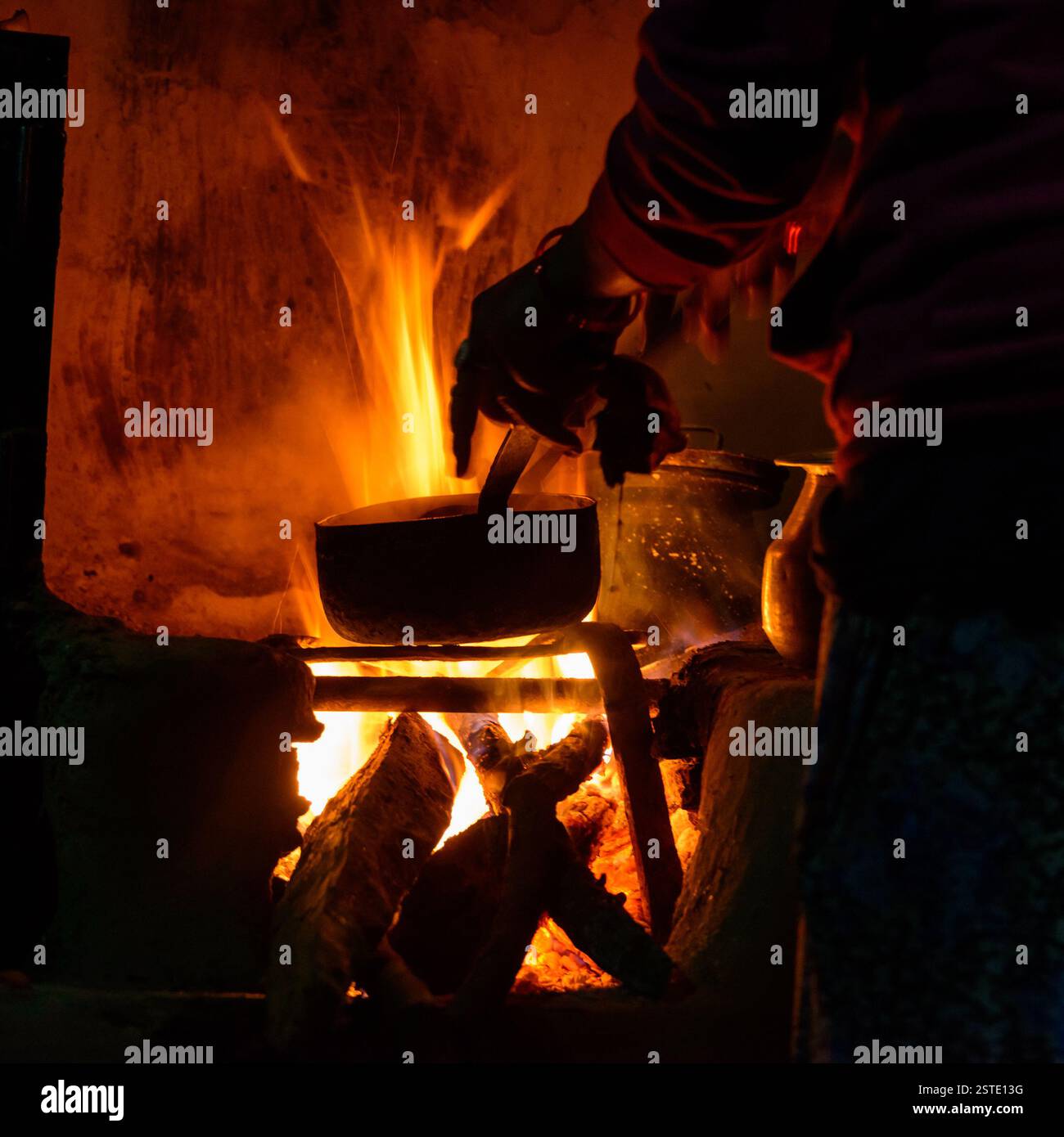 Cooking on wood fire Stock Photo - Alamy