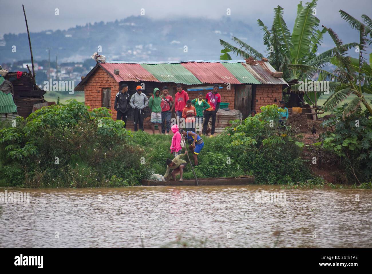 Floods in Antananarivo, Madagascar Villagers wait for their turn to ...