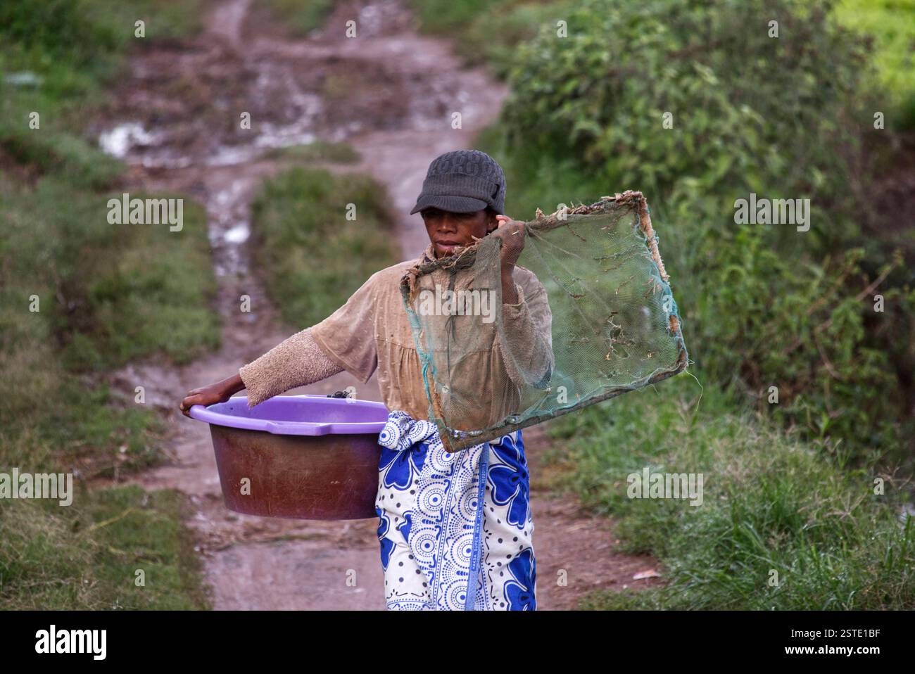 Floods in Antananarivo, Madagascar A fisherwoman sets out early in the ...