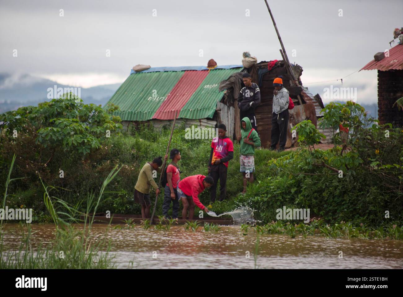 Floods in Antananarivo, Madagascar Villagers wait for their turn to ...