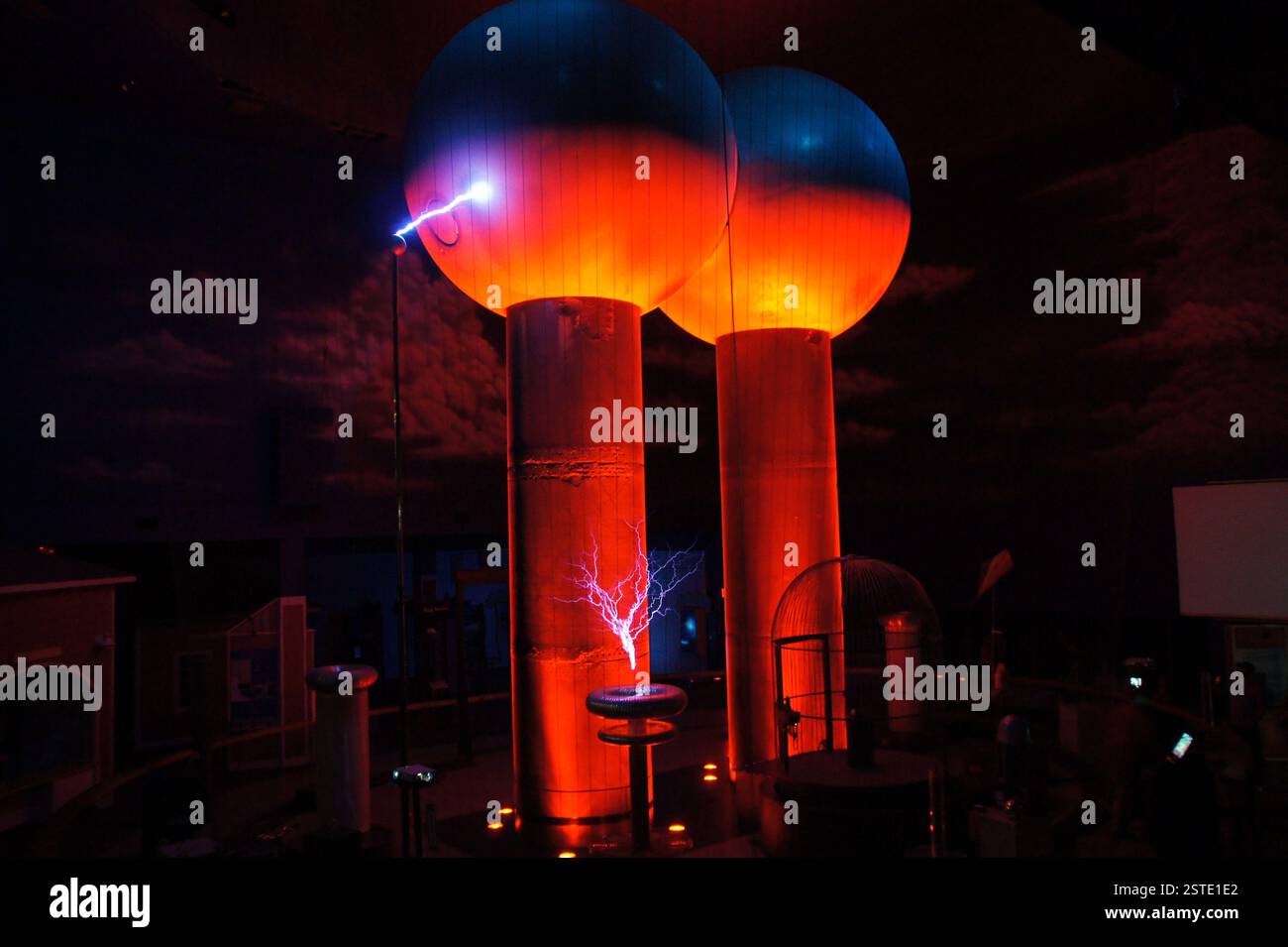 Tesla Coil sparks crackling between giant spheres, illuminating a dark ...