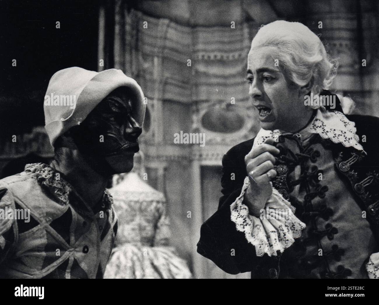 Harlequin, character of the Italian commedia dell'arte, performing at ...