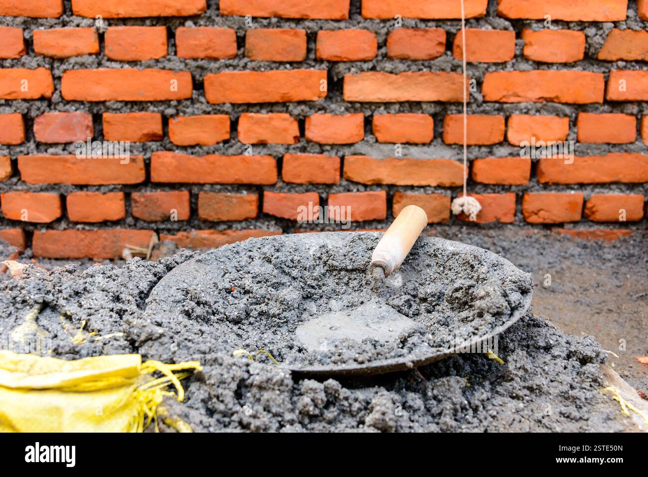 Trowel in fresh cement Stock Photo - Alamy