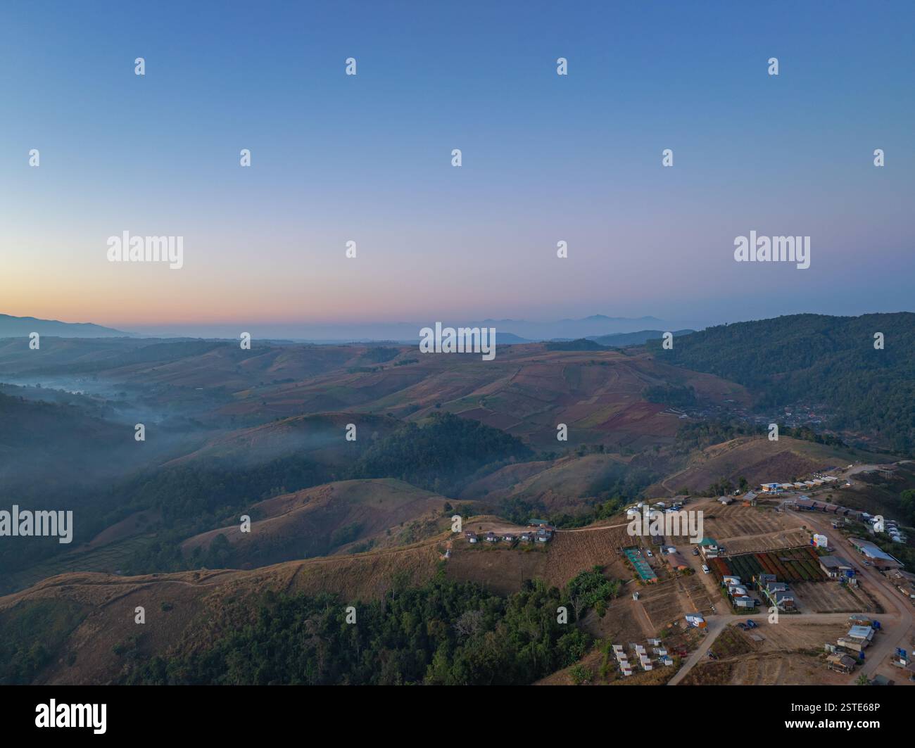Aerial View of An image of sweet sky in sunrise above a valley of mist ...