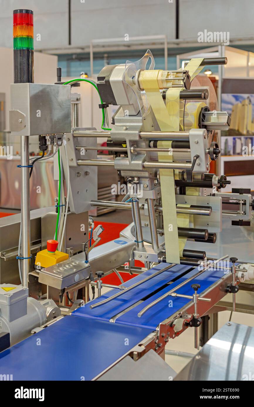 Automated Labeling Machine at Conveyor Belt in Food Production Factory ...