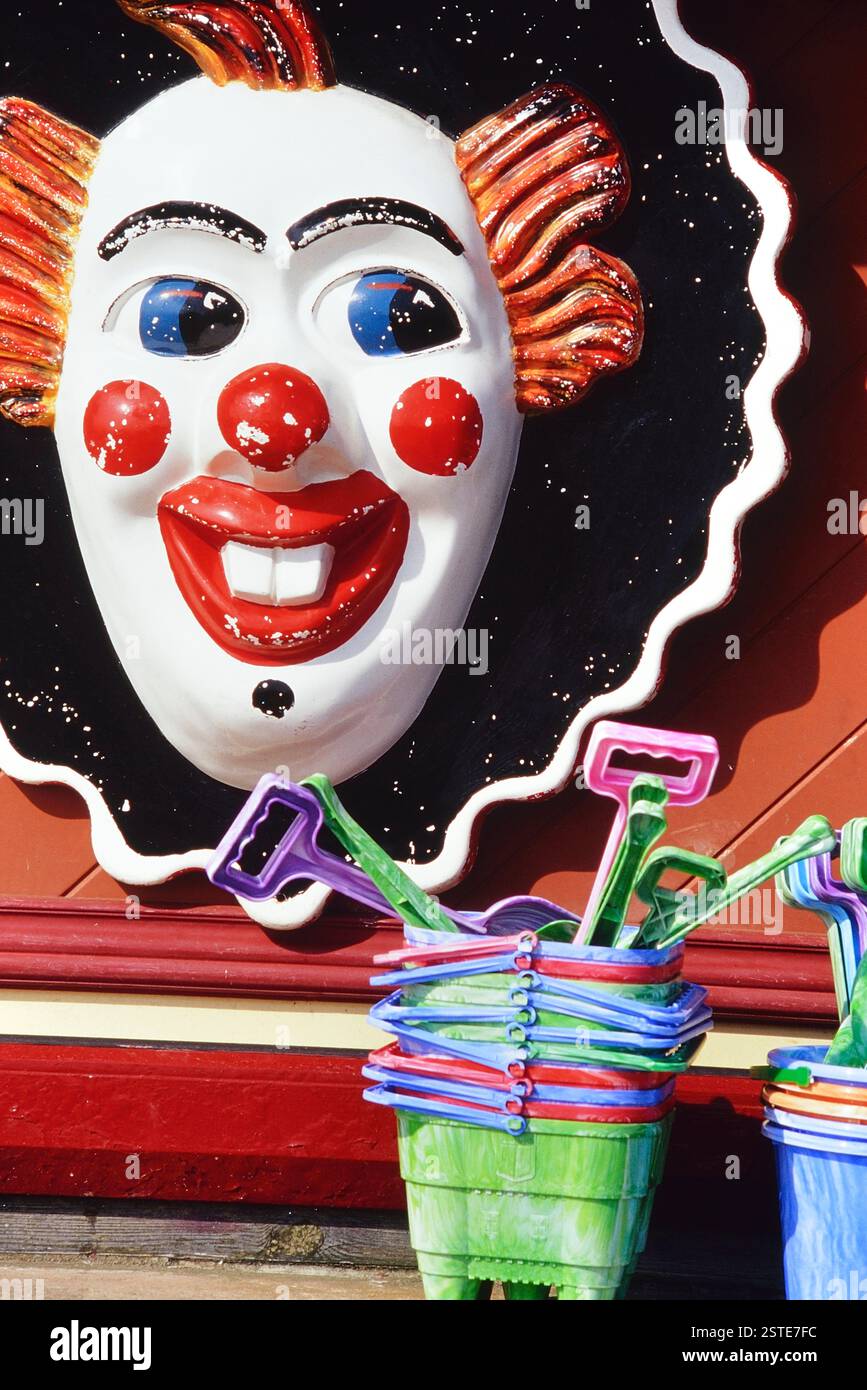Beach bucket and spades for sale beside an clown face mask, Blackpool ...