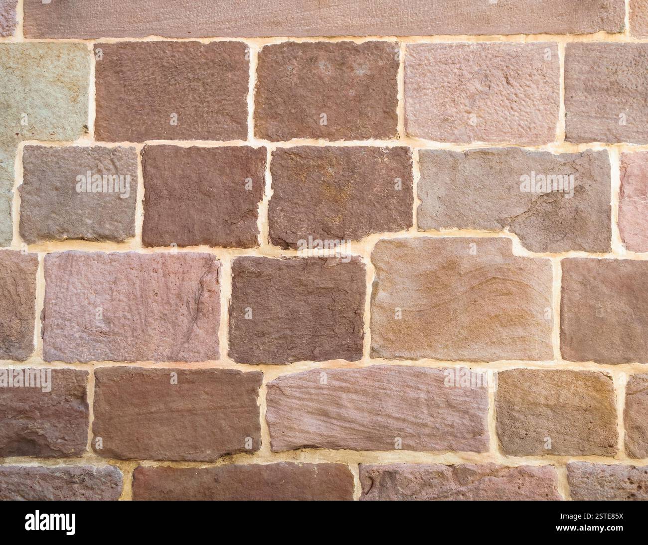 Red stone wall background Stock Photo - Alamy