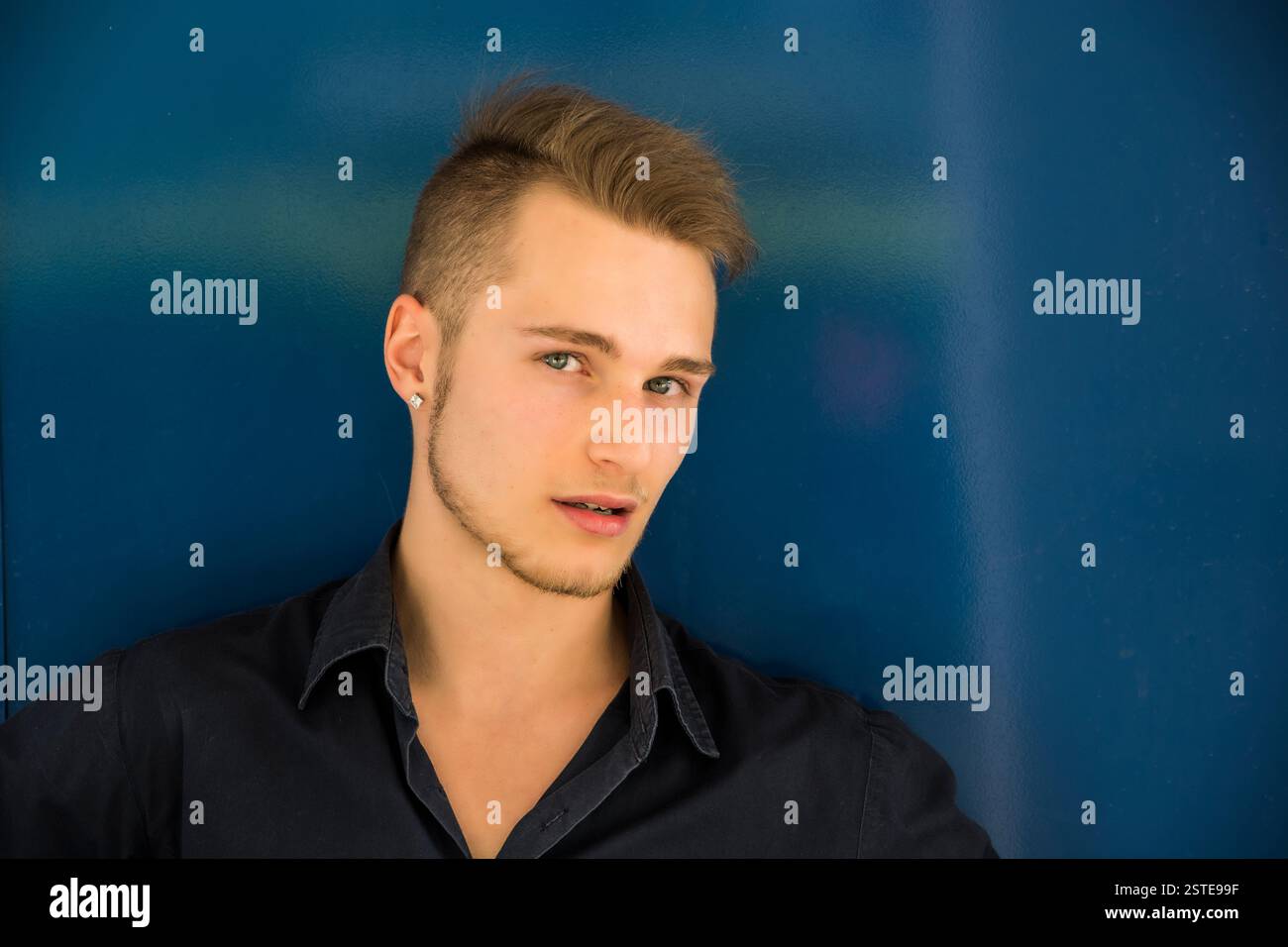 Handsome young man blond hair and blue eyes hi-res stock photography ...