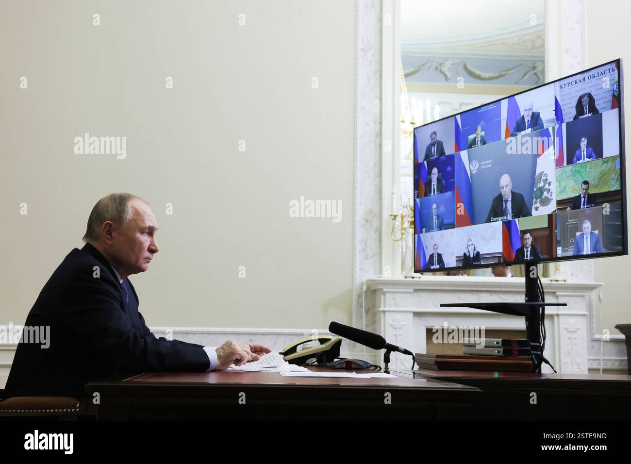 Russian President Vladimir Putin chairs a cabinet meeting via ...