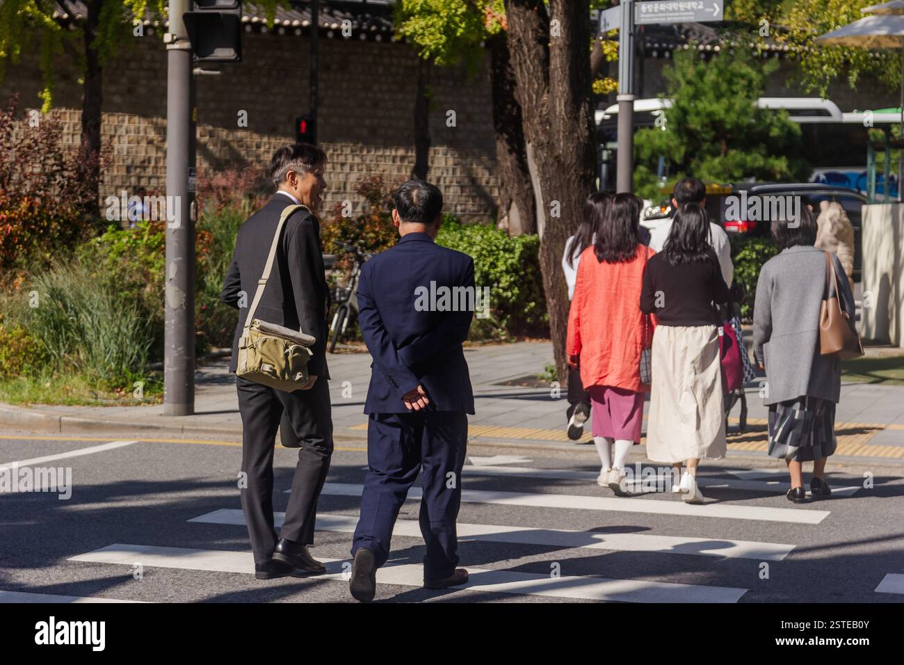 Seoul, South Korea - October 26, 2024: People walking across a ...