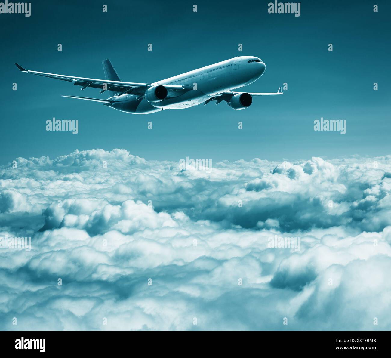 Aircraft flies over clouds hi-res stock photography and images - Alamy