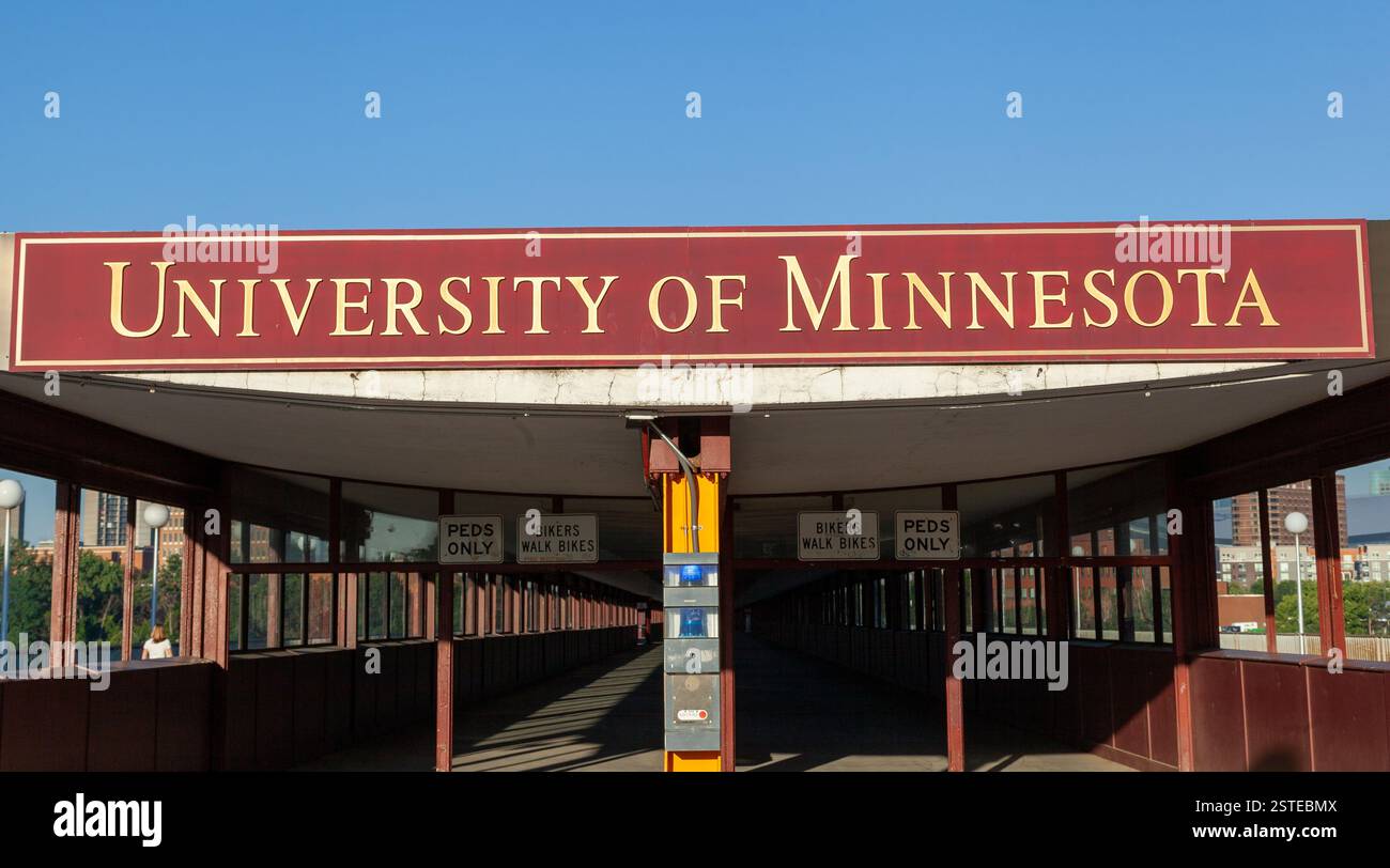 The University of Minnesota sign hangs over the entrance of the ...