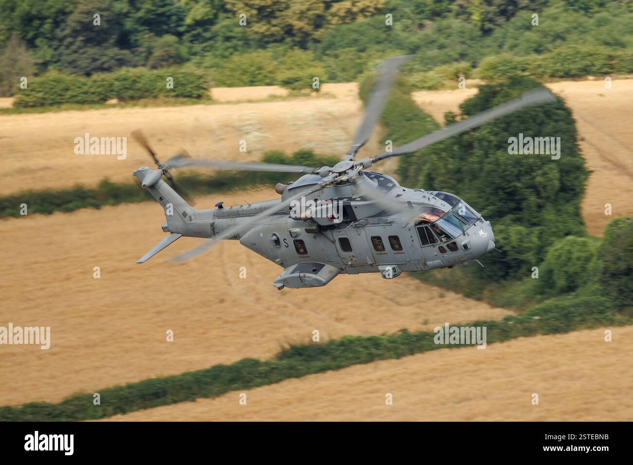 Helicopter flying low through the Wye Valley Stock Photo - Alamy