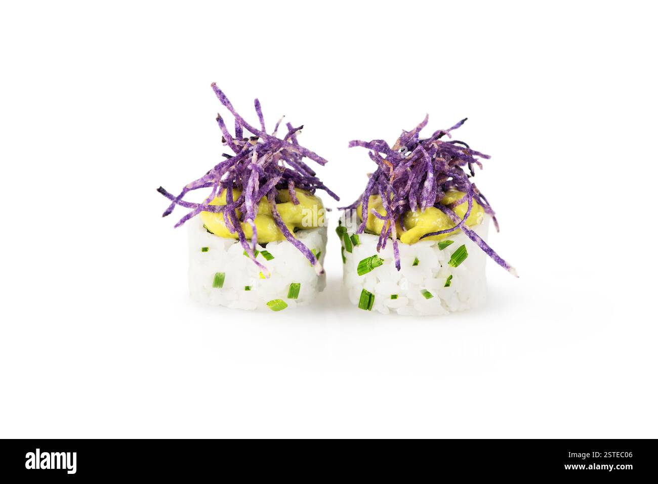 Two gourmet sushi rolls topped with a vibrant purple shredded vegetable ...