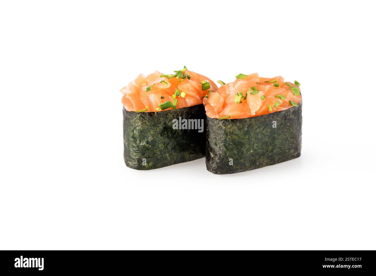 A vibrant image showcasing two pieces of salmon gunkan maki, delicately topped with chopped ...