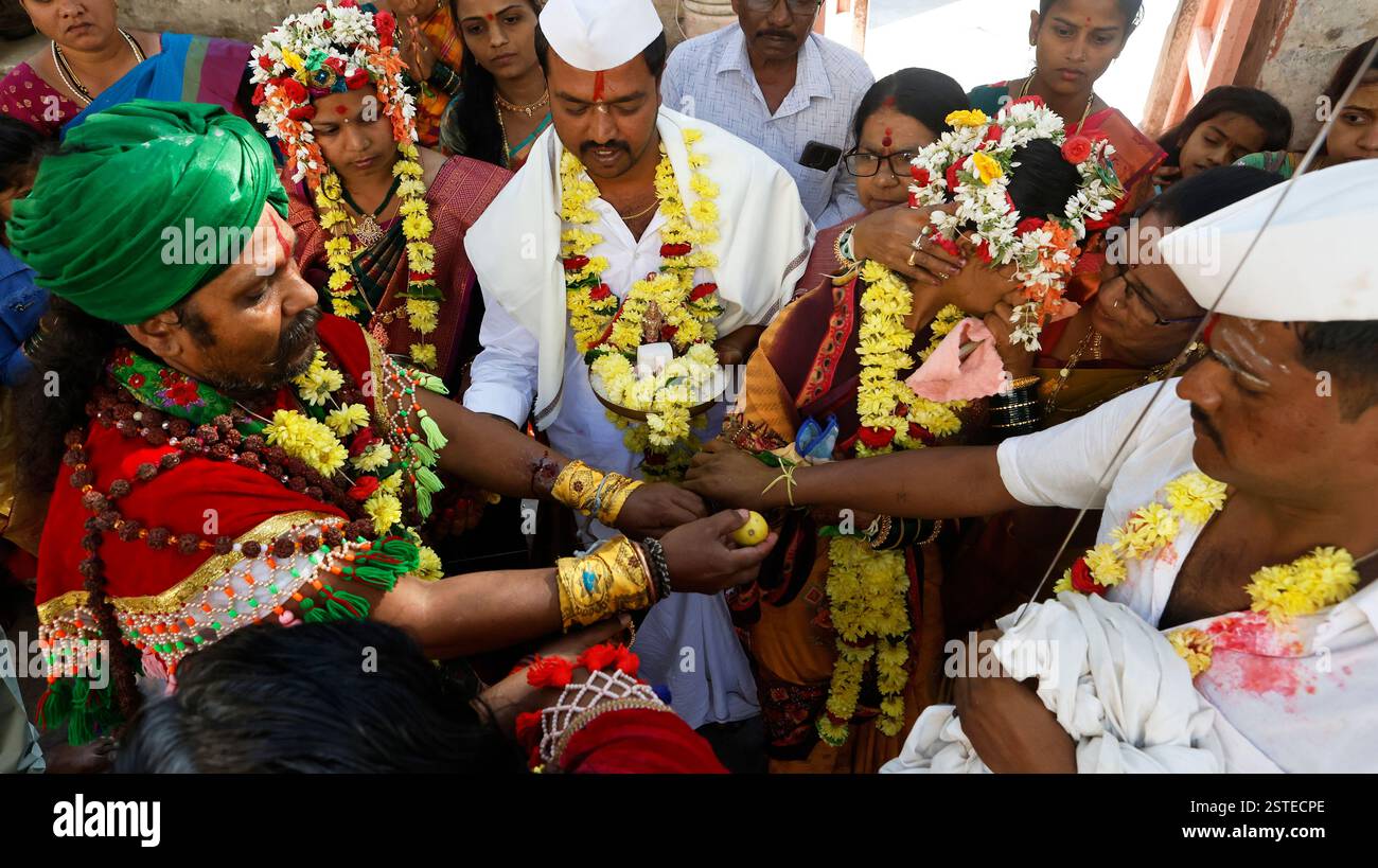 A bride has her skin pierced above the wrist at a wedding ceremony in ...