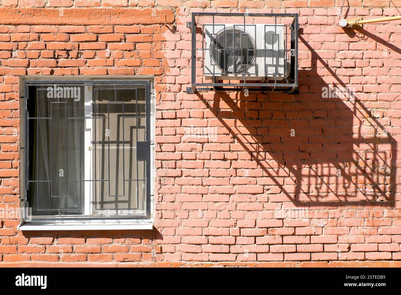 Window and air conditioner on a brick wall Stock Photo - Alamy