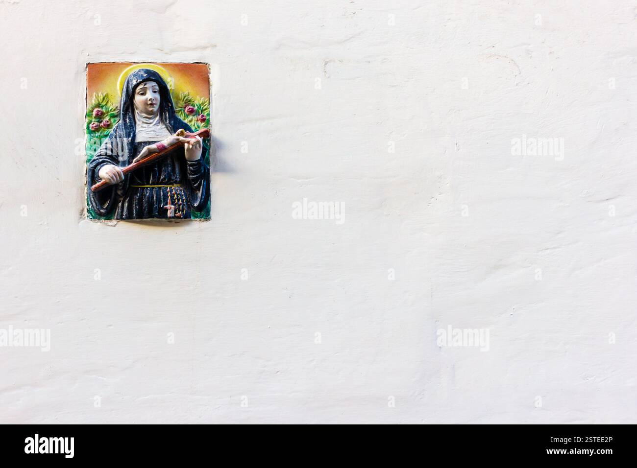 Decorative Religious Figurine Embedded in a White Wall Capturing ...