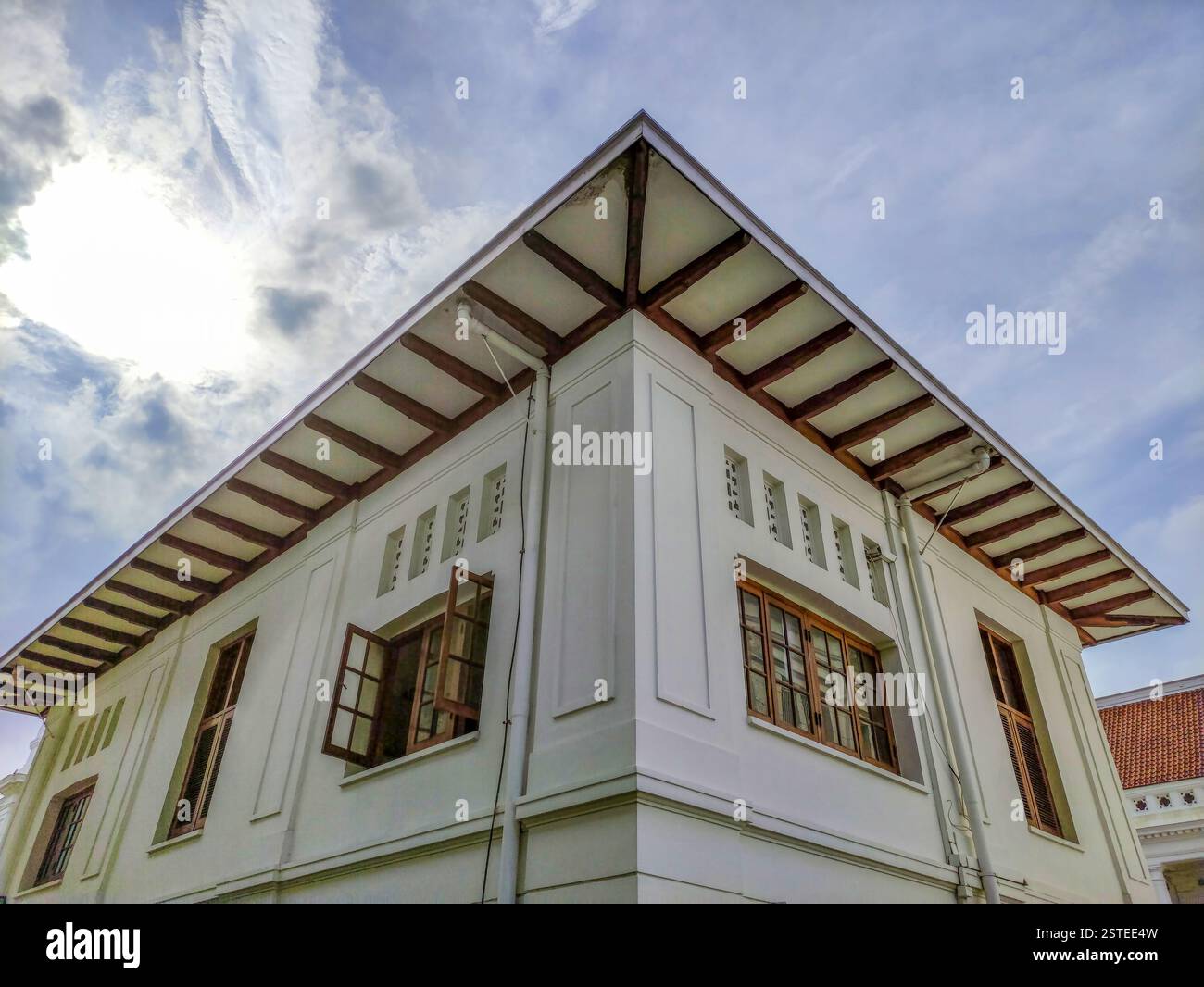 Colonial Style White Building with Wooden Windows on a Clear Sky Day ...