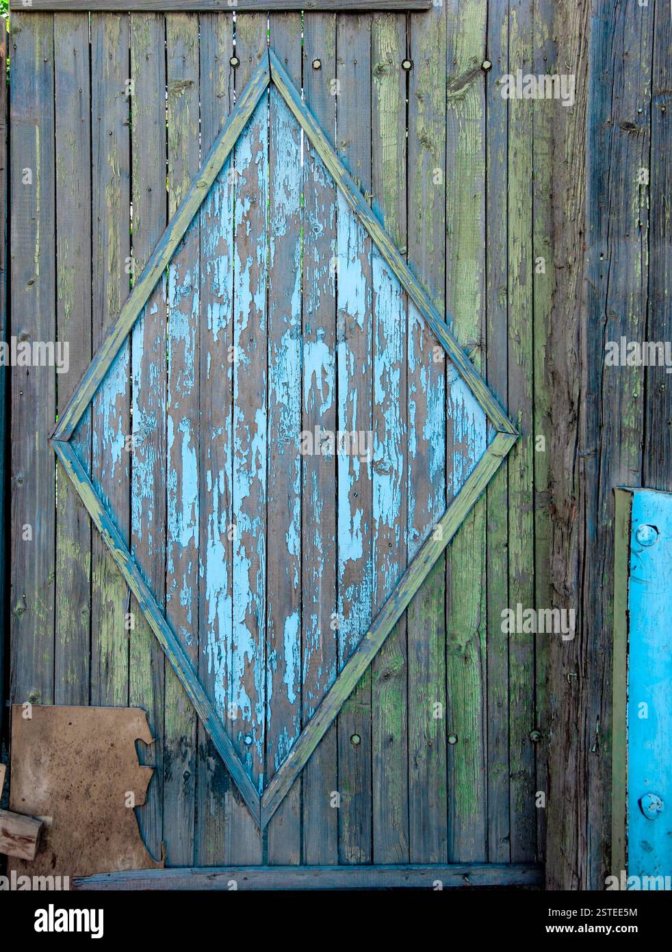 Blue obsolete gates of slum house Stock Photo - Alamy
