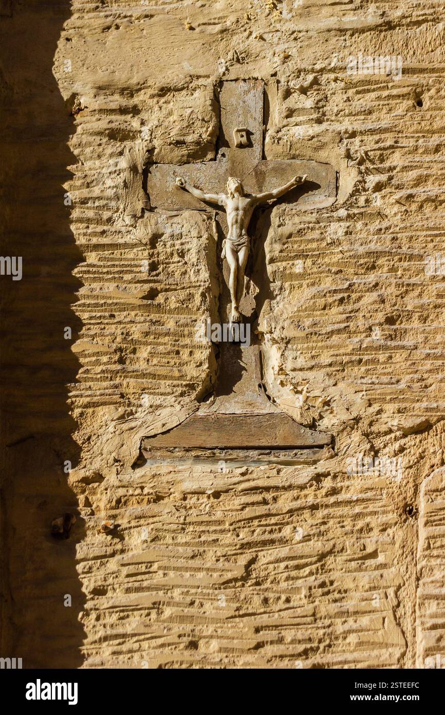 Crucifix Illustration Embedded in Textured Stone Wall with Artistic ...