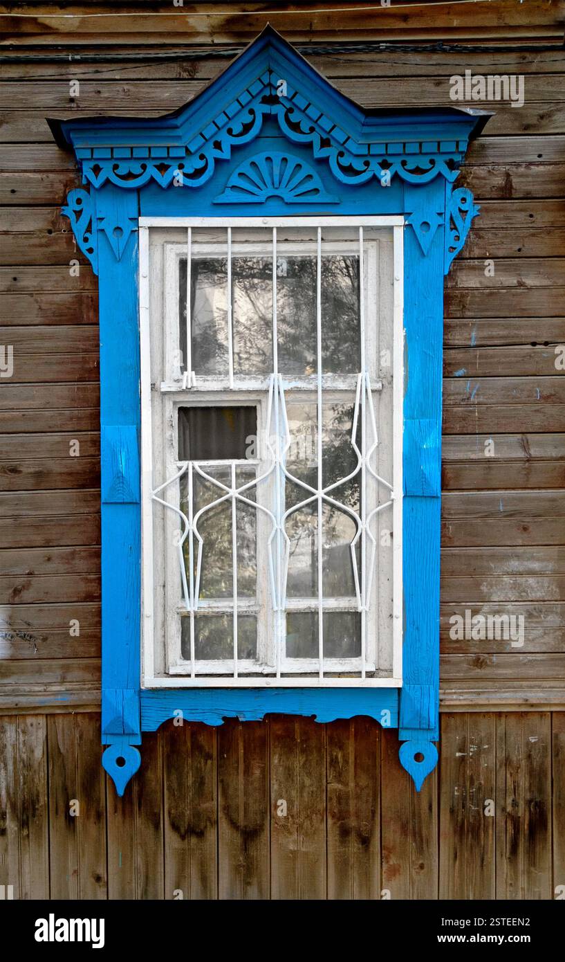 Blue window in traditional tribal Russian style on facade of ancient ...