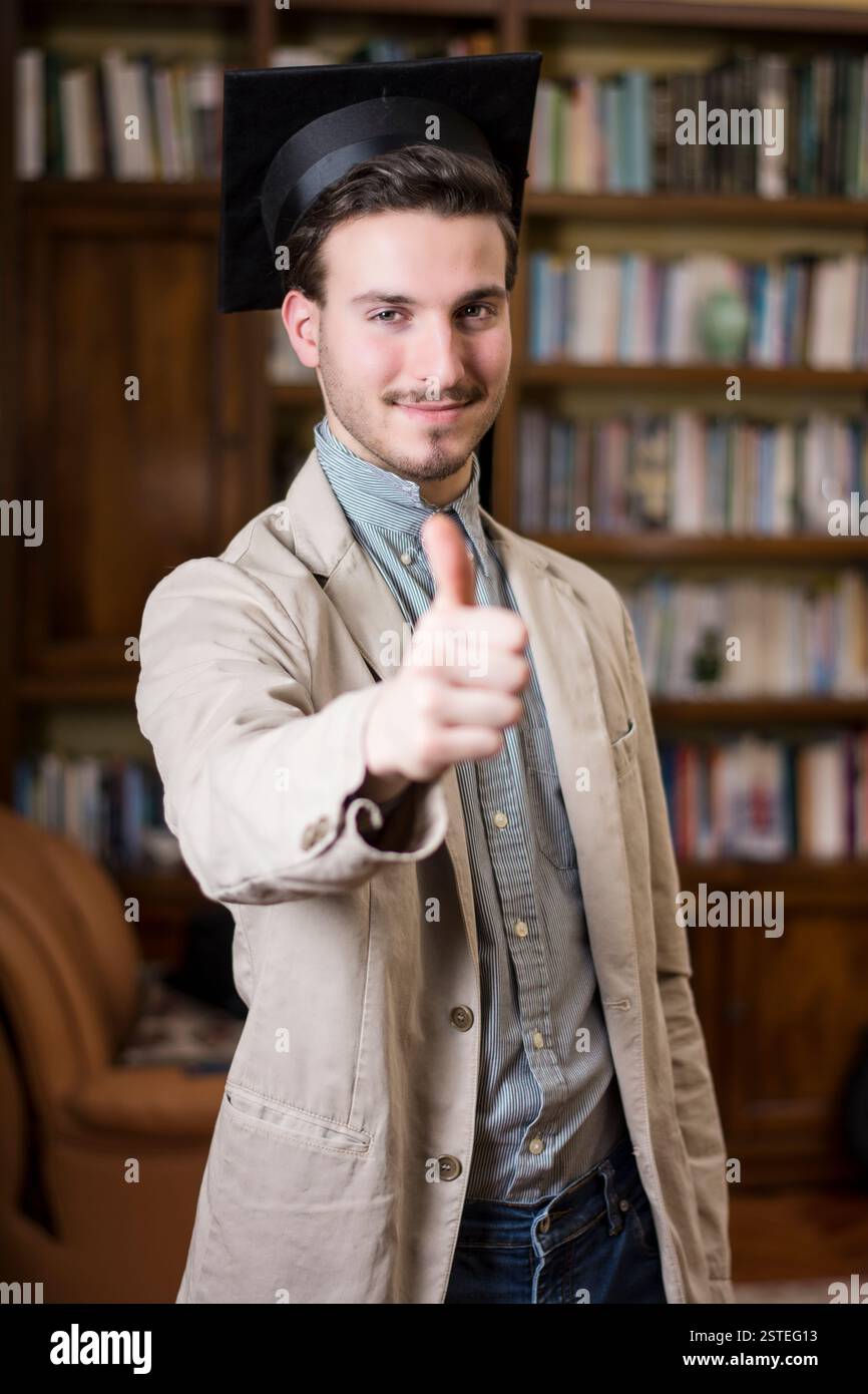 Happy young man graduating from college Stock Photo - Alamy