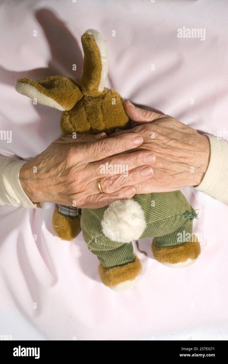 Old demented person with stuffed rabbit hi-res stock photography and ...
