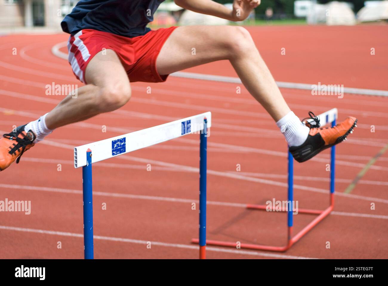 Man jump track hurdles hi-res stock photography and images - Alamy