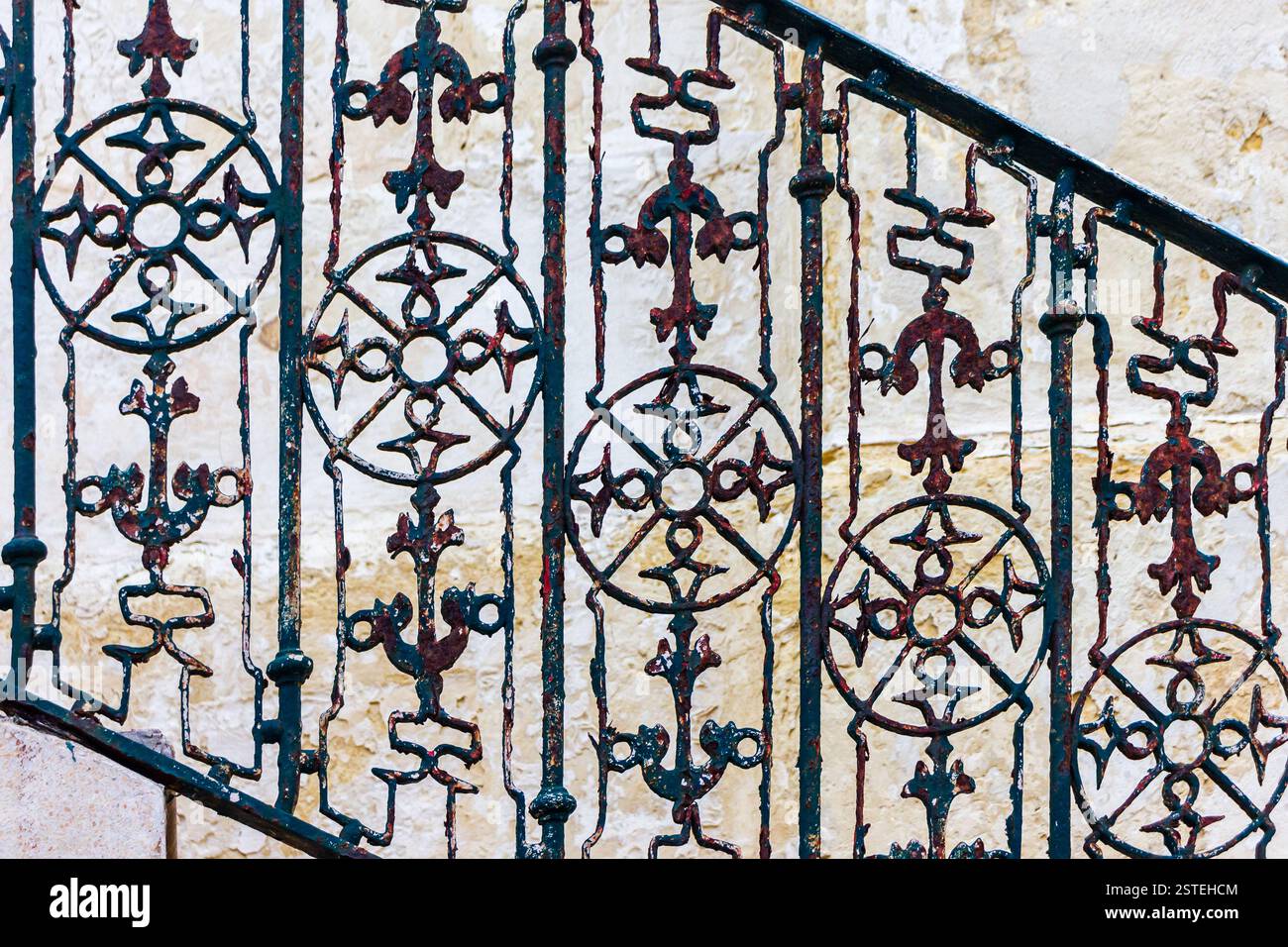 Rustic Wrought Iron Railing with Ornate Patterned Details in an Outdoor ...