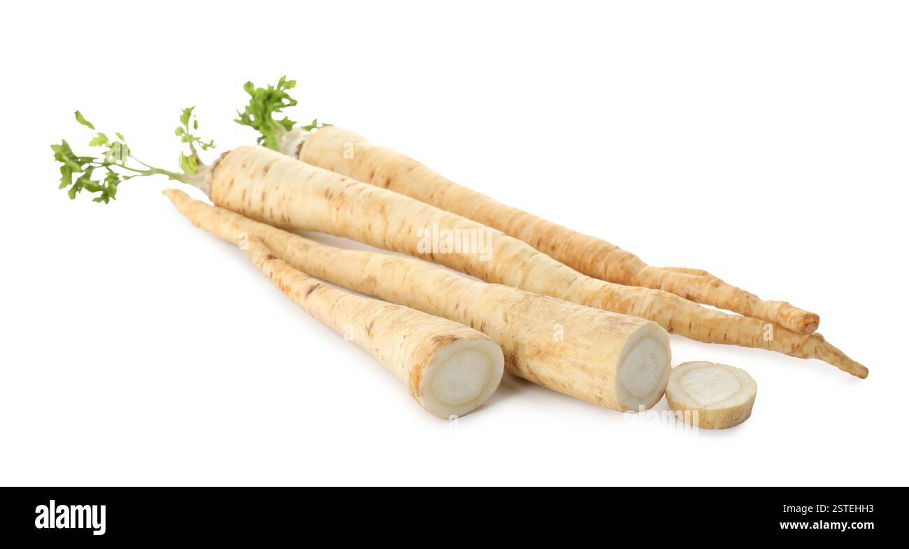 Whole and cut fresh parsley roots isolated on white Stock Photo - Alamy
