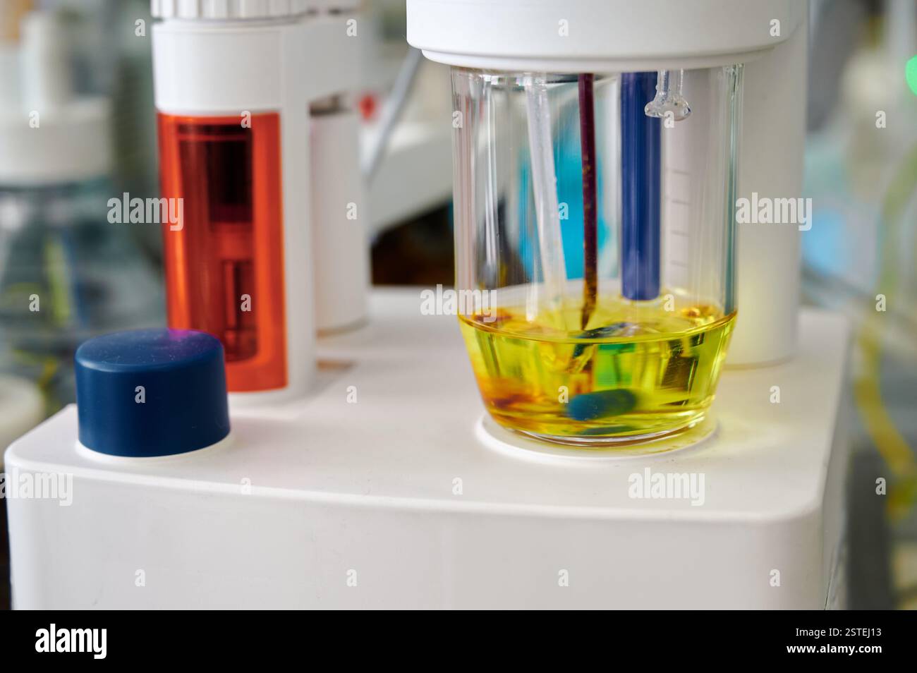 Colorful mixture of liquids in laboratory vessel during chemical ...