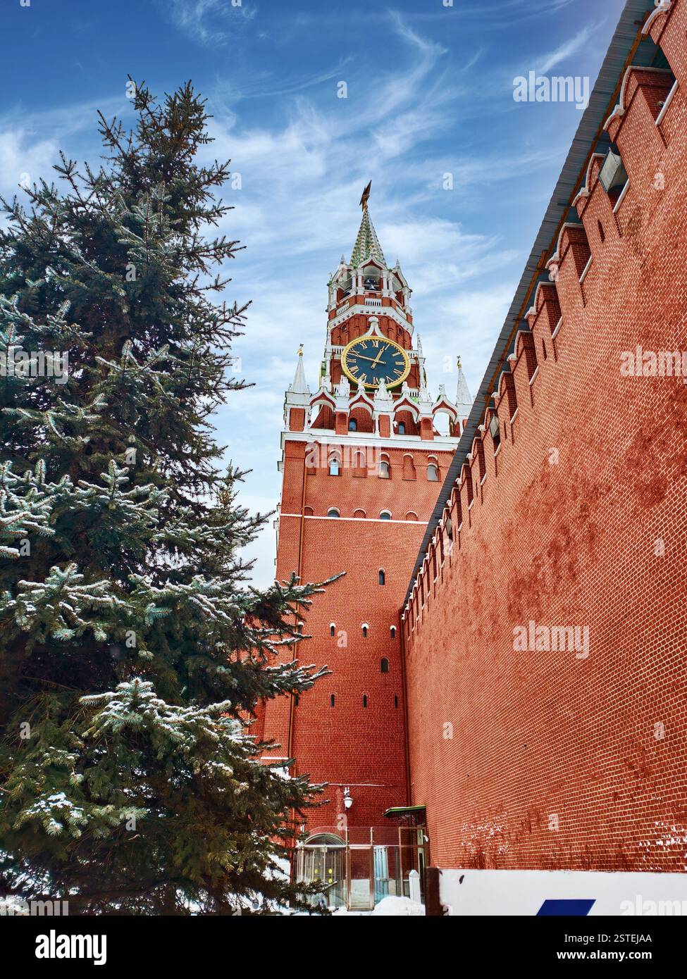 Snow-covered Kremlin tower stands tall against a stunning winter sky in ...