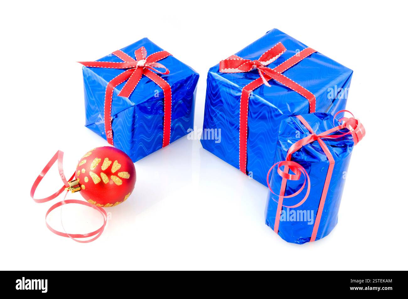 Christmas presents in blue with red ribbon and ball Stock Photo - Alamy